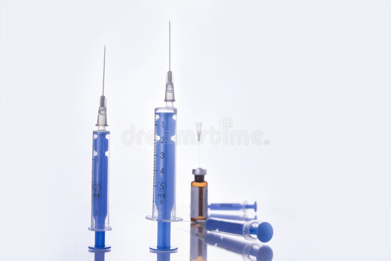 Two Shots Stand Up and Two Injections Laying Stock Photo - Image of ...