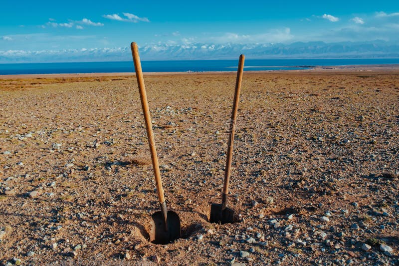 Two Shovels for Digging a Hole, Earthworks Concept Stock Image - Image ...
