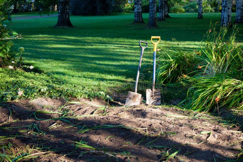 Two shovels in ground stock image. Image of countryside - 53864801
