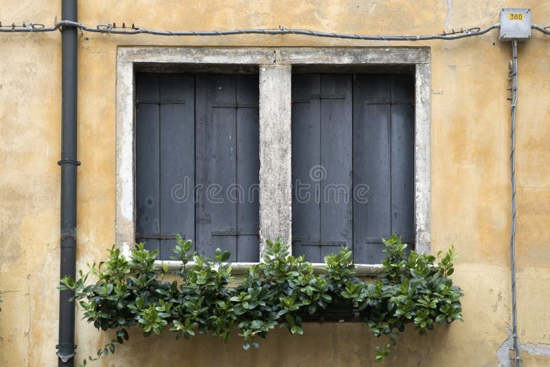 Two shuttered windows stock image. Image of exterior - 107972327