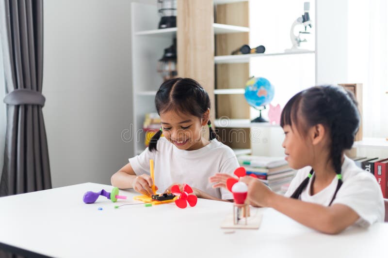 Two Sibling Asian Girl Playing Windmill Stacks Stock Photo - Image of ...