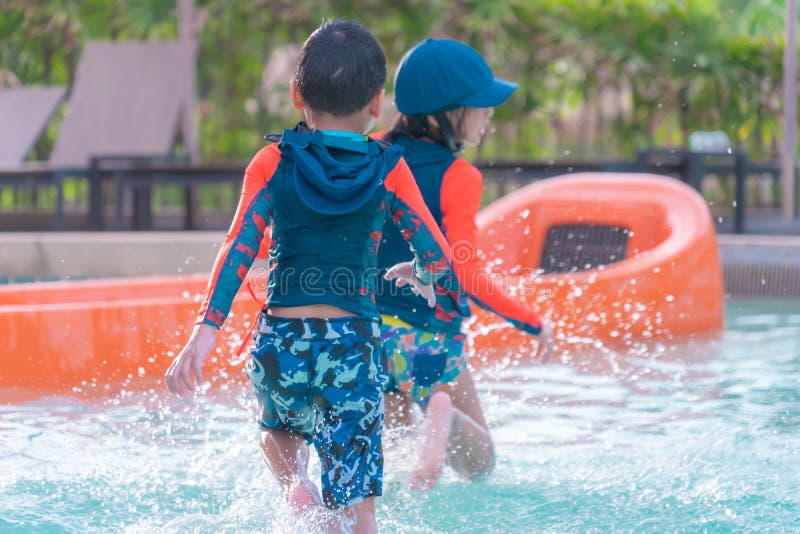 Two Siblings in Playing Together in Water Aqua Park Pool Stock Photo ...