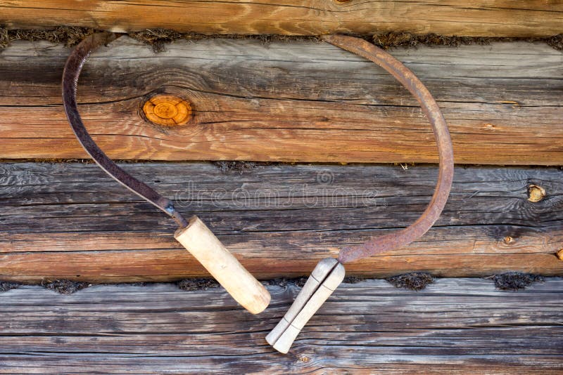 Two Sickle on the Background of Wooden Wall Stock Image - Image of ...