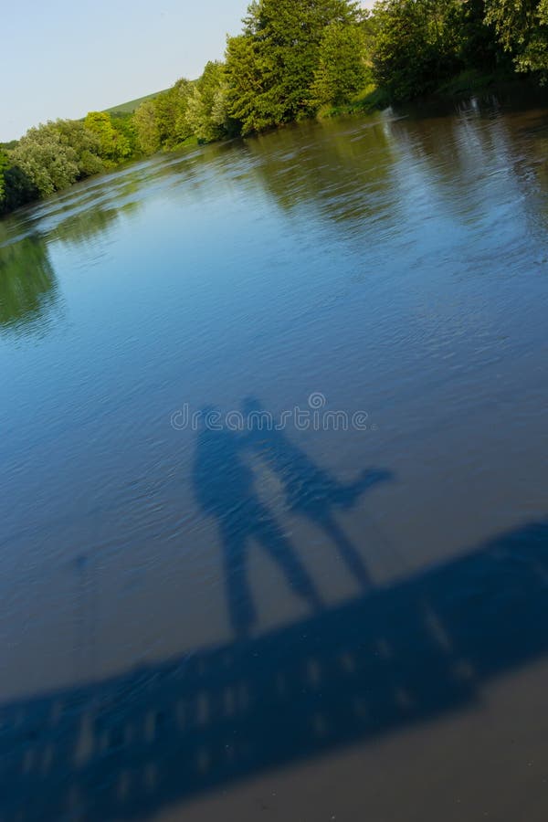 Couple S Shadows Reflected on Tranquil River during a Sunny Day in ...