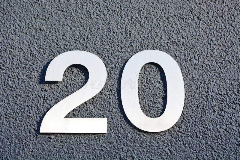 Two Silver Metallic Digits Fixed on a Wall and Showing the Number ...