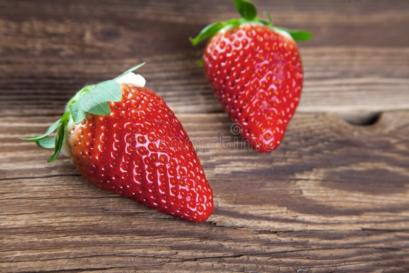 Two Single Strawberries on Wood Stock Photo - Image of tasty, health ...