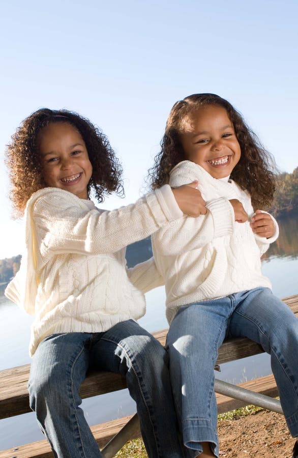 Two sisters stock photo. Image of family, elementary, biracial - 7139342