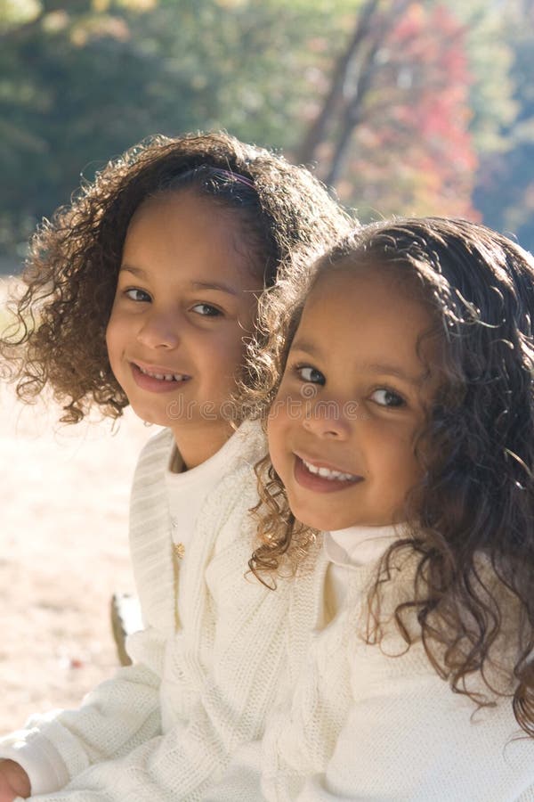 Two sisters stock photo. Image of biracial, park, schoolkids - 7139366