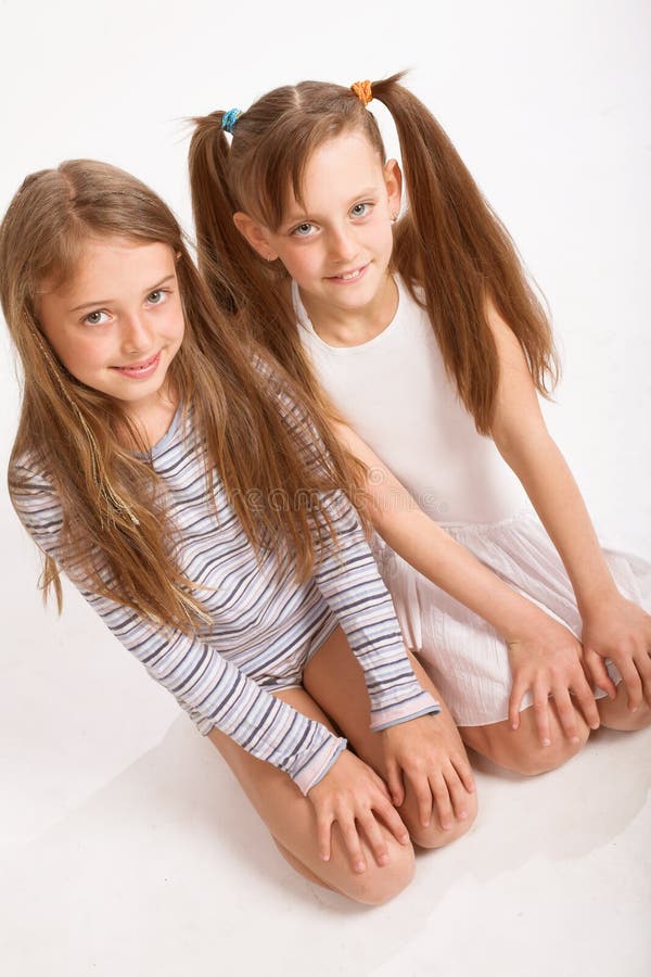 Two Teen Girls in Pantyhose Modeling Fashion Clothes in Studio Stock ...