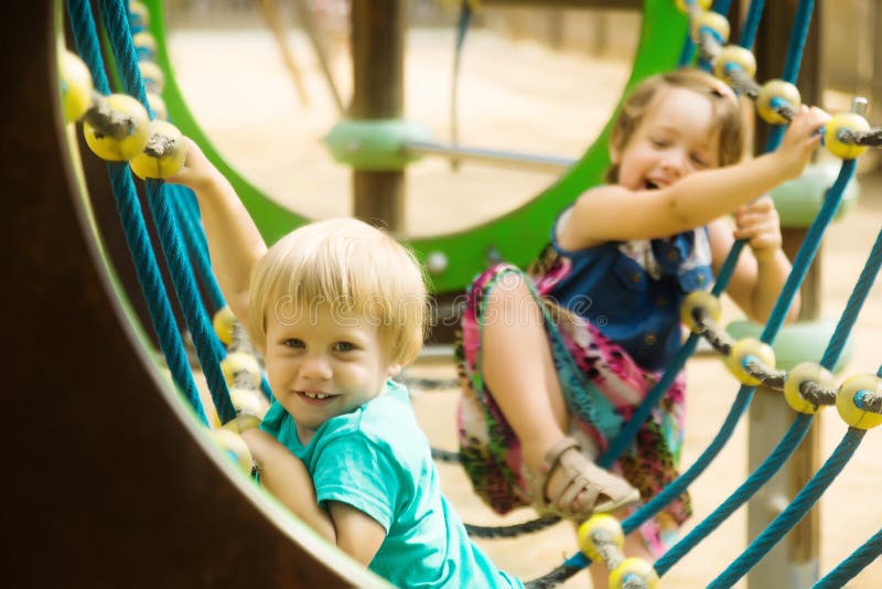 Two Sisters at Action-oriented Playground Stock Image - Image of climb ...