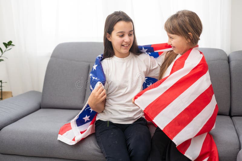 Two Sisters with American Flag on Grey Background Stock Image - Image ...