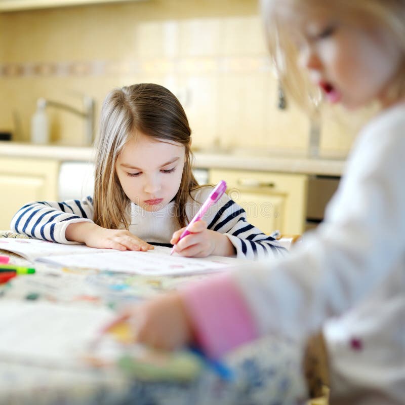 Two Sisters Drawing and Learning Together Stock Image - Image of ...