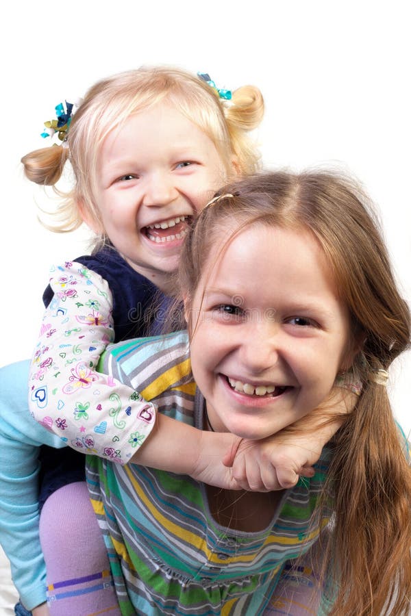 Two sisters embracing stock image. Image of young, smiling - 22336647