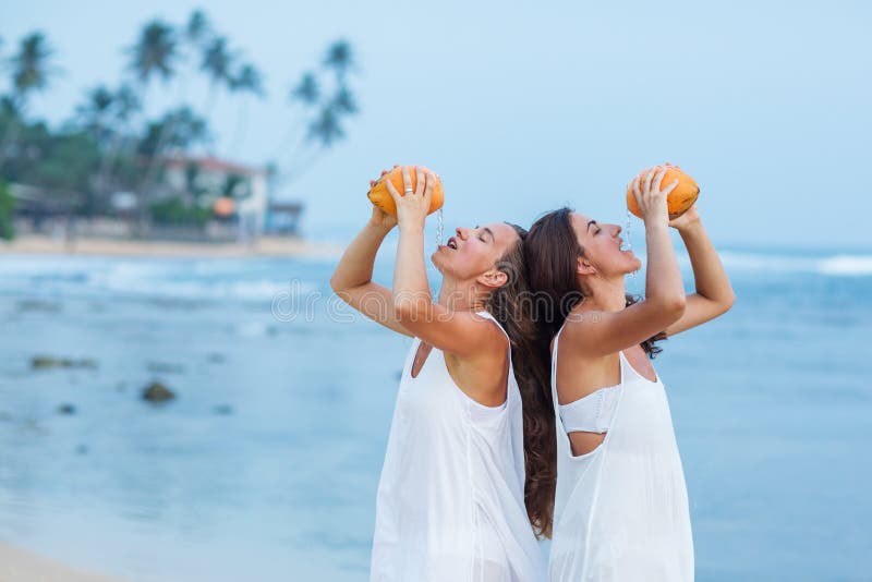 Two Sisters Having Fun at the Sea at the Sunset Stock Image - Image of ...