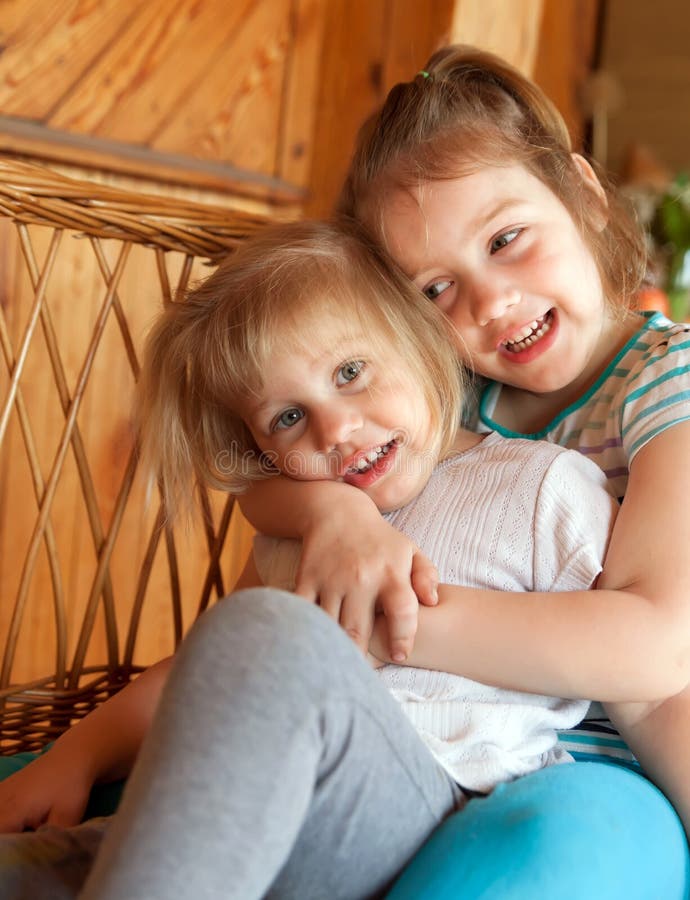 Two sisters hugging stock image. Image of girls, family - 61831969