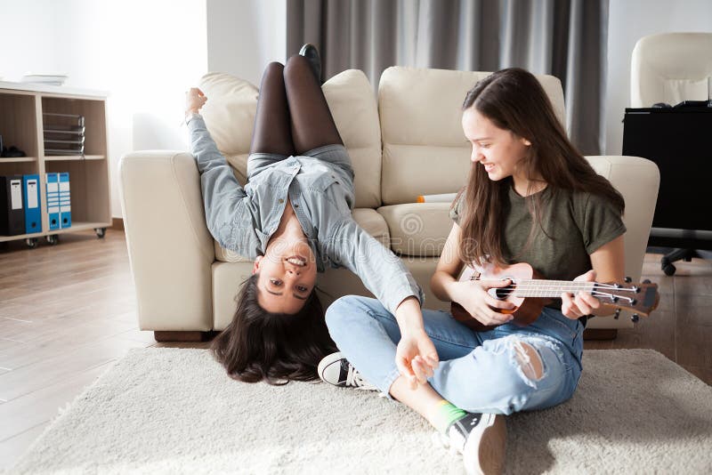 Two Sisters in the Living Room Having Fun Stock Image - Image of party ...