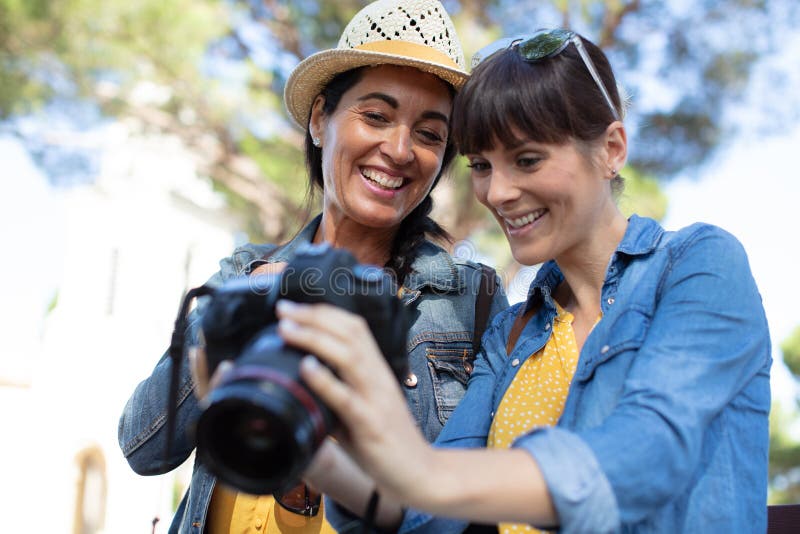 Two Sisters Making Checking Camera Stock Photo - Image of photograph ...