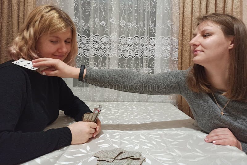 Sisters Play Cards at Table Stock Photo - Image of cards, adult: 188978964