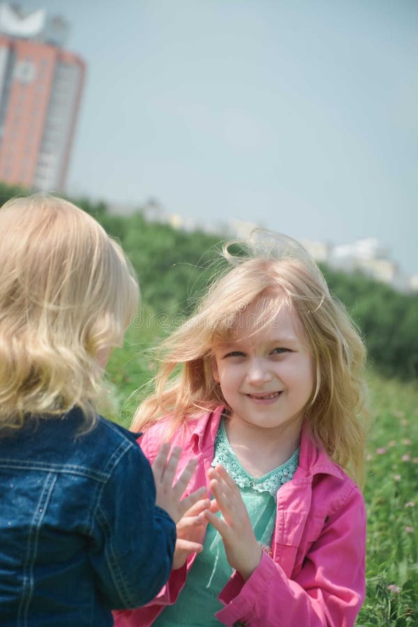 Two Sisters Play in the Park on the Grass Stock Image - Image of dreamy ...