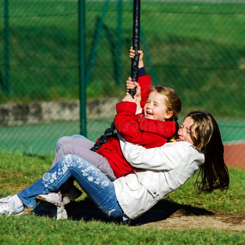 Two Sisters Playing in the Playground, Sunny Day Stock Photo - Image of ...