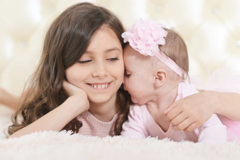Two sisters playing stock image. Image of portrait, baby - 118162163