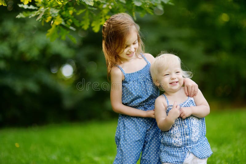 Two Sisters Portrait Outdoors Stock Image - Image of laugh, foliage ...