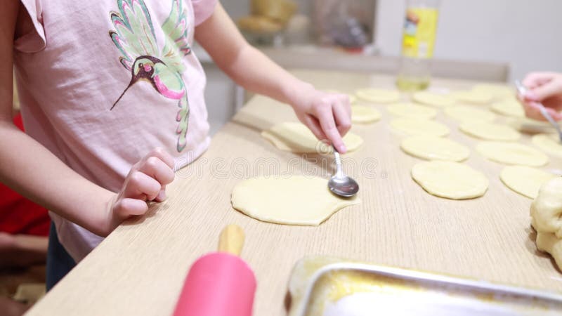 Two Sisters Roll Out Dough for Cooking and Baking Homemade Buns Stock ...