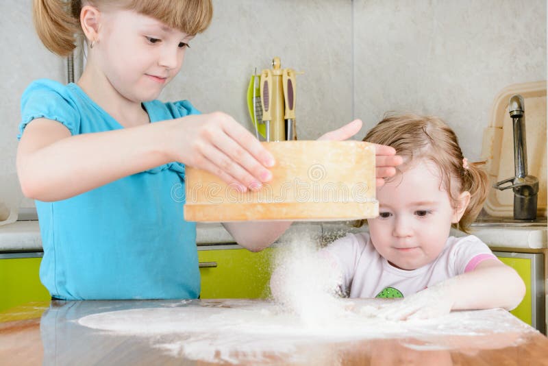 Two Sisters Sifts the Flour for Dough Stock Image - Image of baker ...