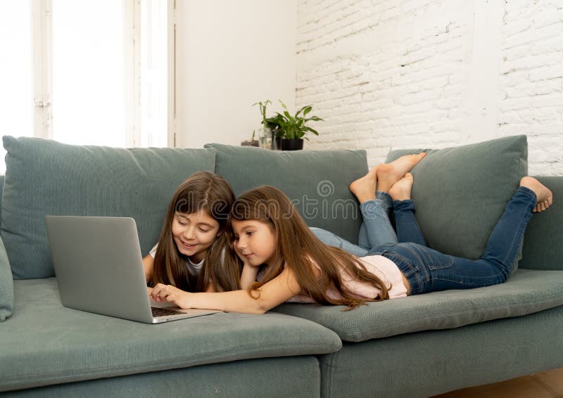 Two Cute Sisters Playing Together Having Fun Posing And Modeling Stock