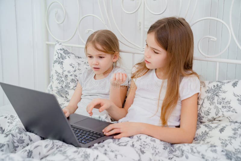 Stay Home. Two Sisters Study on Computer Online. Stock Photo - Image of ...