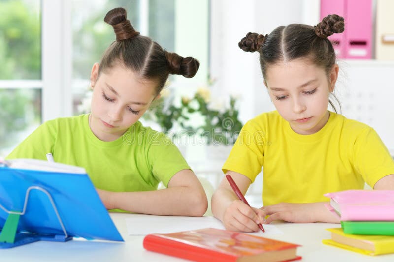 Two sisters twins stock photo. Image of learning, room - 122543038