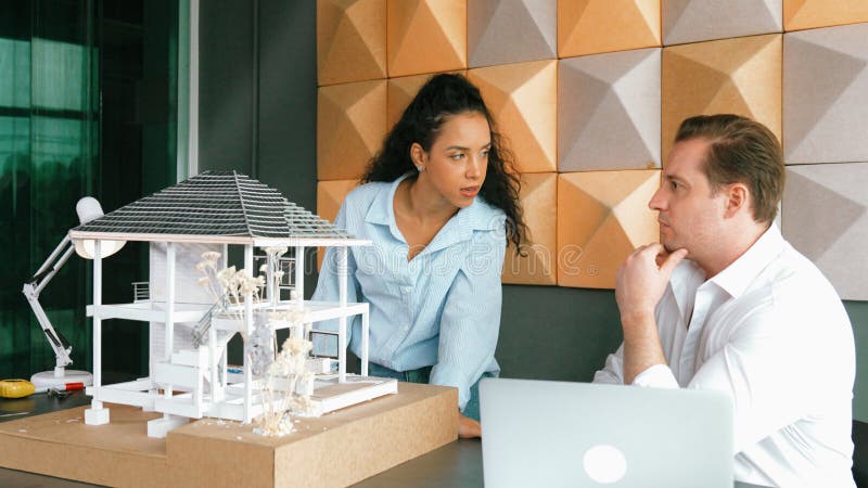 Two Skilled Professional Engineer Team Discuss about House Model ...