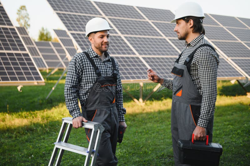 Two Skilled Workers or Craftsmen Wearing Working Gray Uniforms ...