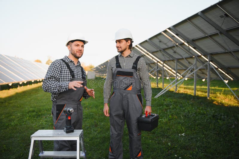 Two Skilled Workers or Craftsmen Wearing Working Gray Uniforms ...