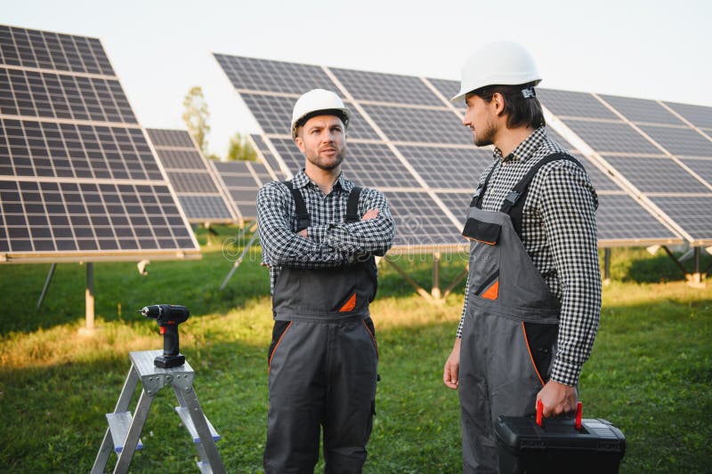 Two Skilled Workers or Craftsmen Wearing Working Gray Uniforms ...