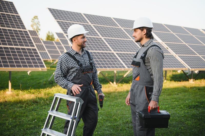 Two Skilled Workers or Craftsmen Wearing Working Gray Uniforms ...