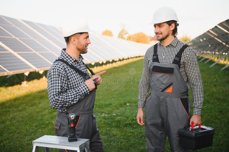 Two Skilled Workers or Craftsmen Wearing Working Gray Uniforms ...