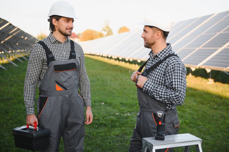 Two Skilled Workers or Craftsmen Wearing Working Gray Uniforms ...