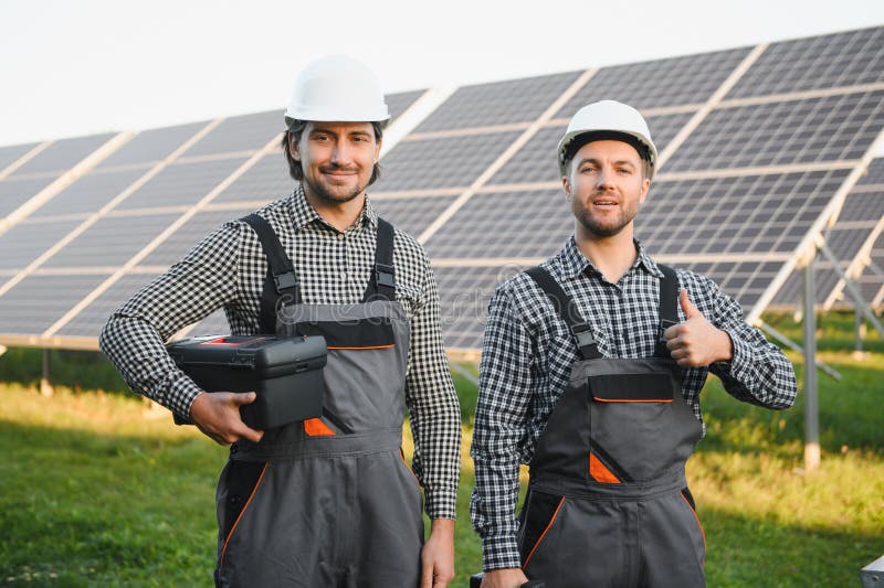 Two Skilled Workers or Craftsmen Wearing Working Gray Uniforms ...