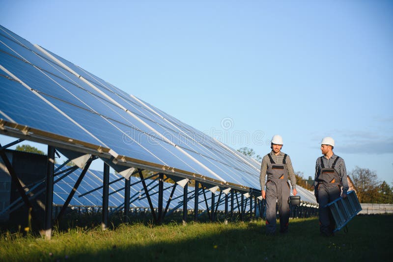 Two Skilled Workers or Craftsmen Wearing Working Gray Uniforms ...