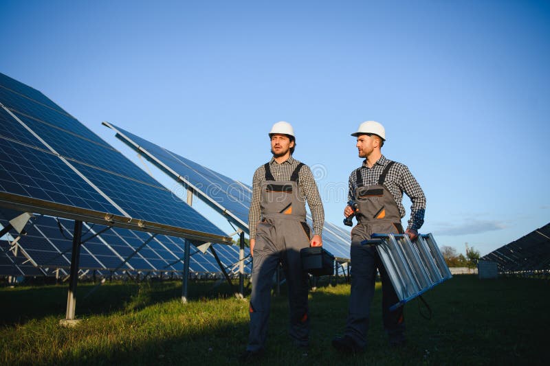 Two Skilled Workers or Craftsmen Wearing Working Gray Uniforms ...