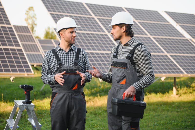 Two Skilled Workers or Craftsmen Wearing Working Gray Uniforms ...