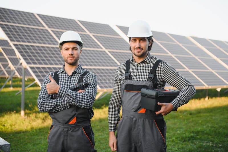Two Skilled Workers or Craftsmen Wearing Working Gray Uniforms ...