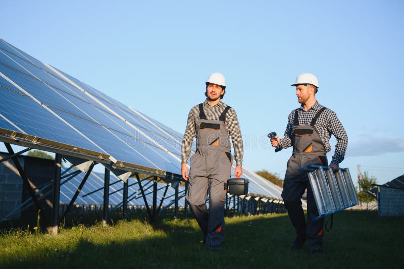 Two Skilled Workers or Craftsmen Wearing Working Gray Uniforms ...