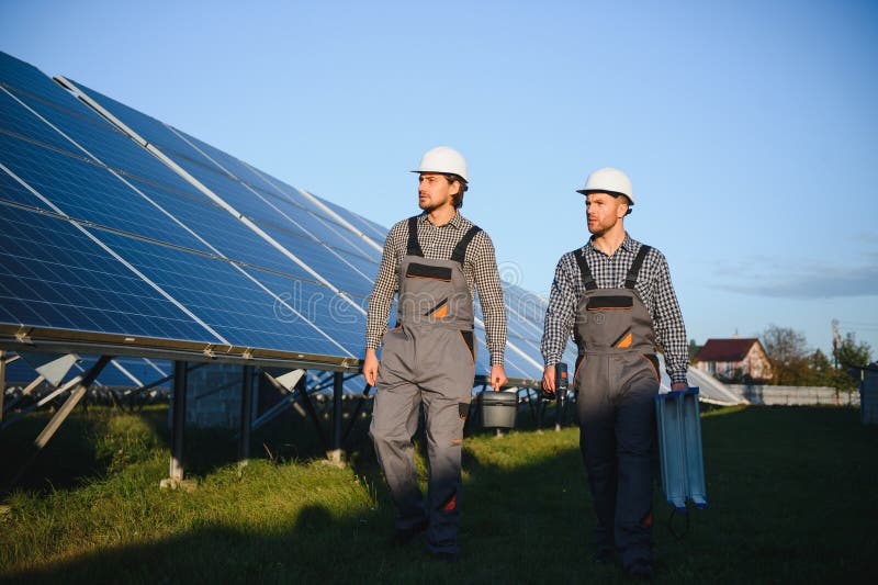 Two Skilled Workers or Craftsmen Wearing Working Gray Uniforms ...