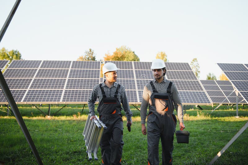 Two Skilled Workers or Craftsmen Wearing Working Gray Uniforms ...