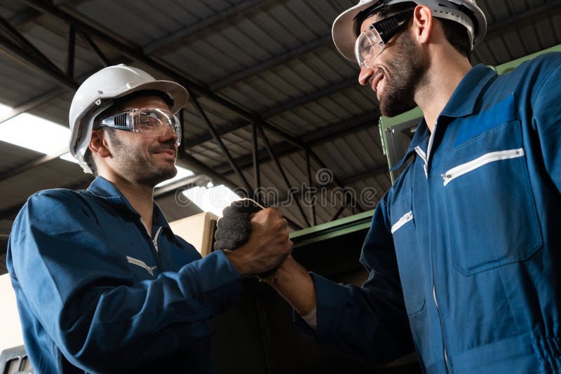 Two Skillful Factory Engineer or Worker Showing Teamwork and ...