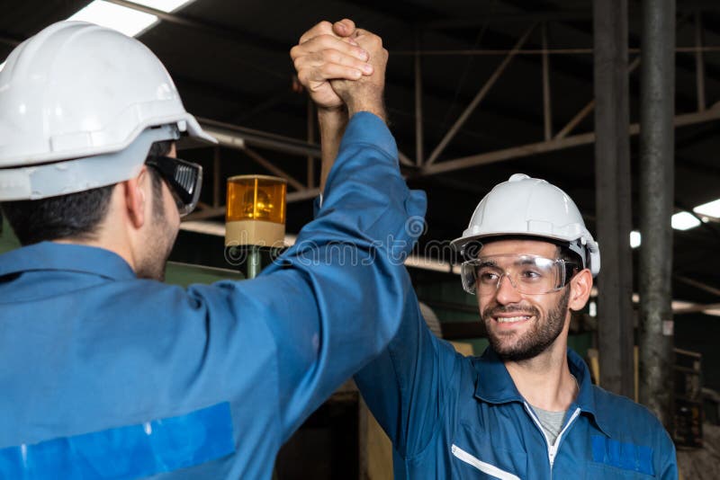 Two Skillful Factory Engineer or Worker Showing Teamwork and ...