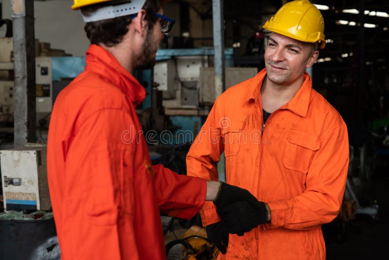 Two Skillful Factory Engineer or Worker Showing Teamwork and ...