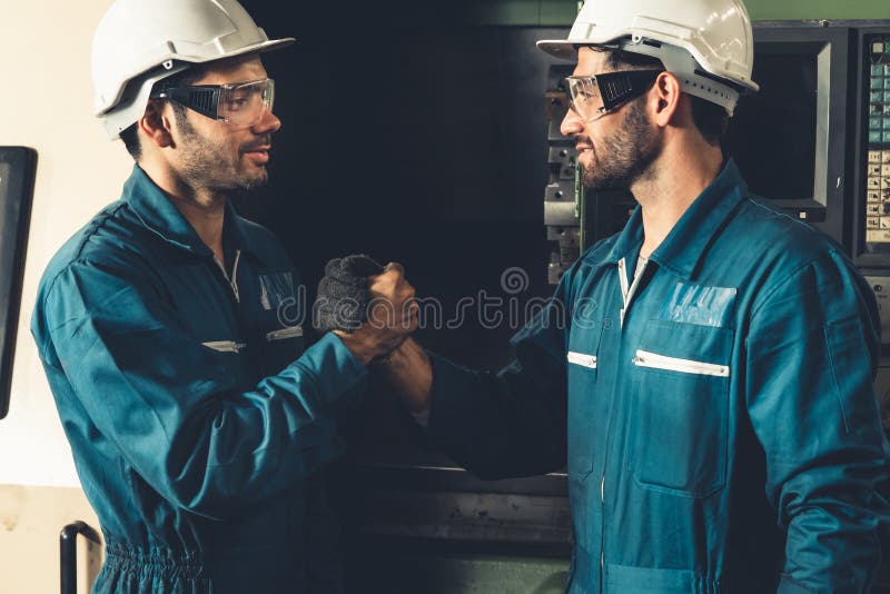 Two Skillful Factory Engineer or Worker Showing Teamwork and ...